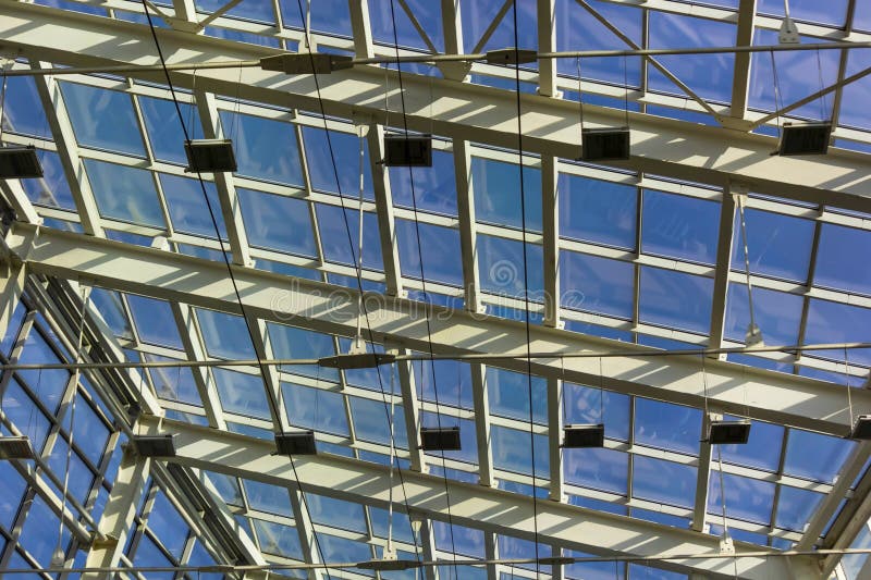 Ceiling Structure Made of Metal and Glass. Blue Sky View Stock Image ...
