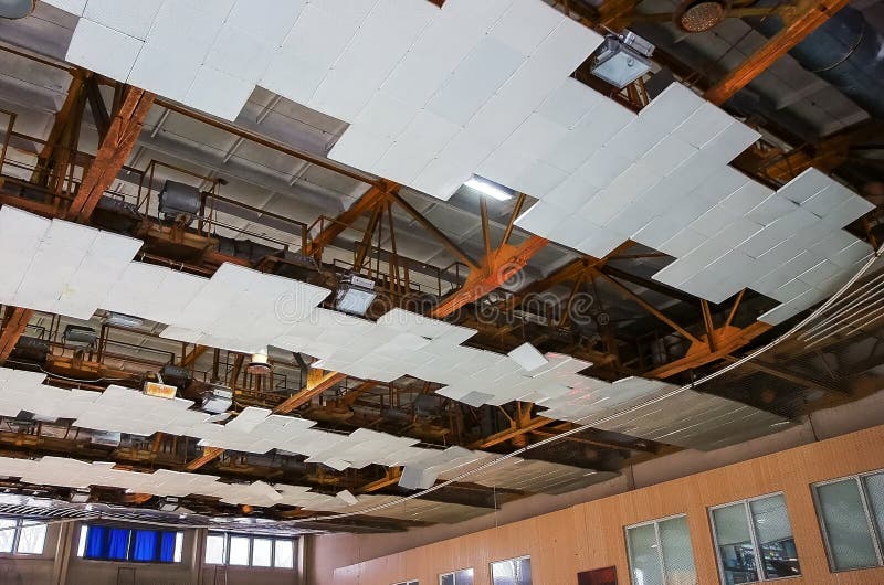 Ceiling Under Repair in an Old Ice Arena with Missing Tiles and Visible ...