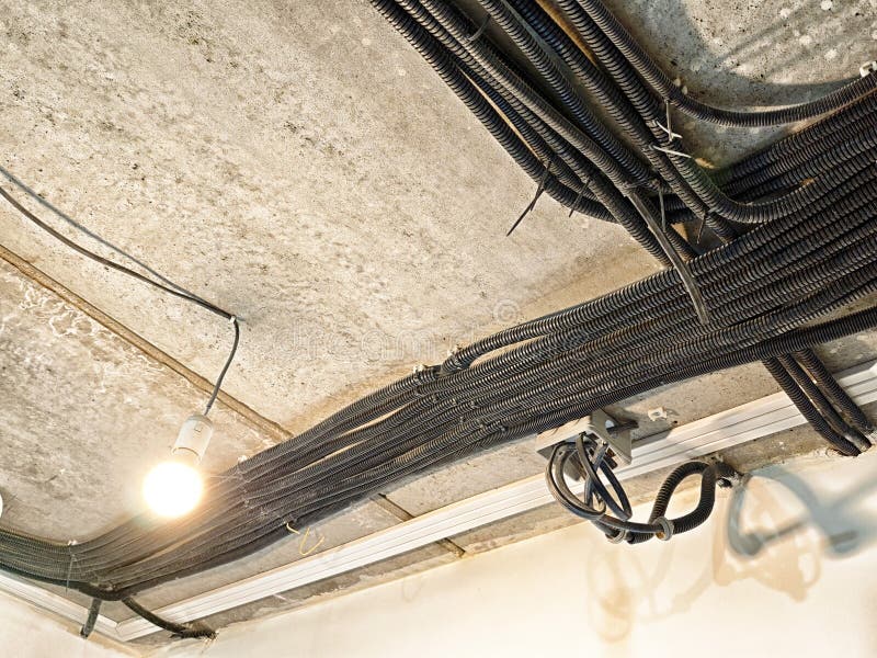 Ceiling View of Electrical Cables and Lighting in an Unfinished ...