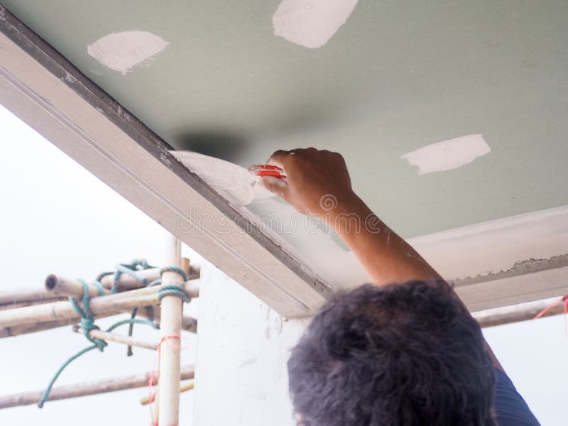 The Ceiling Worker is Plastering the Ceiling Joints with High Quality ...