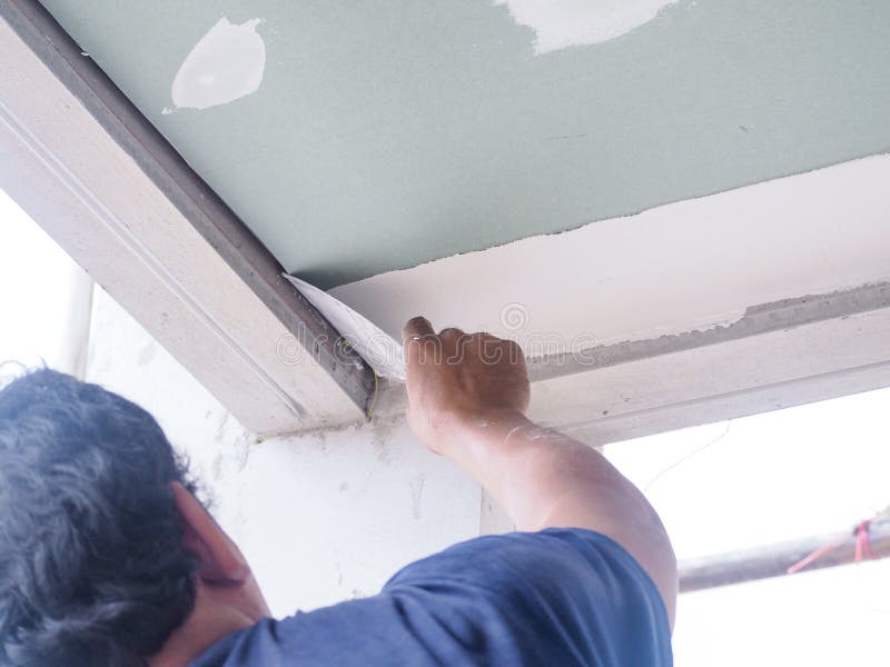 The Ceiling Worker is Plastering the Ceiling Joints with High Quality ...