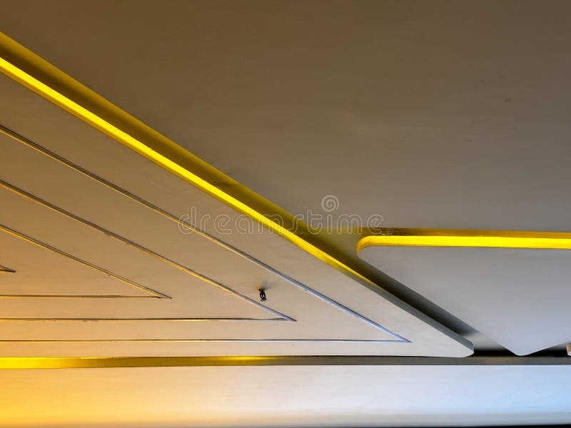 A Ceiling with a Yellow Light Shining on it Stock Photo - Image of roof ...
