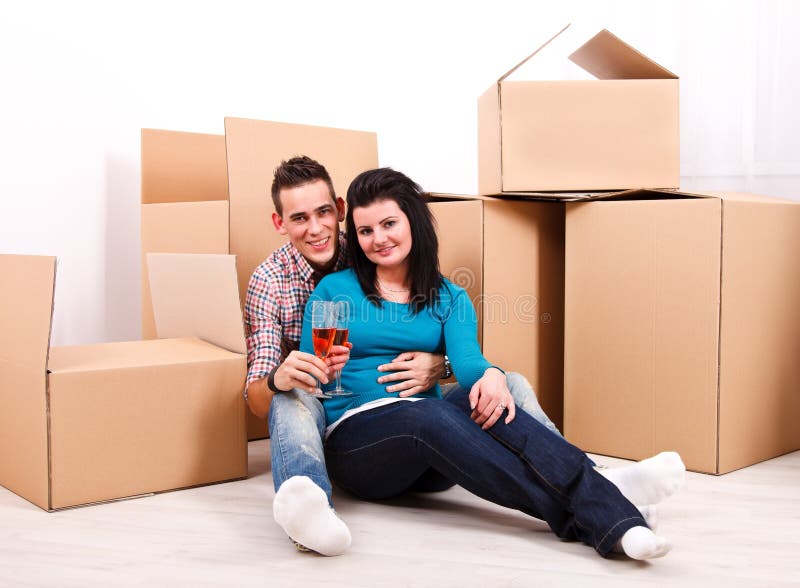 Celebrating Moving Together Stock Photo - Image of looking, sitting ...