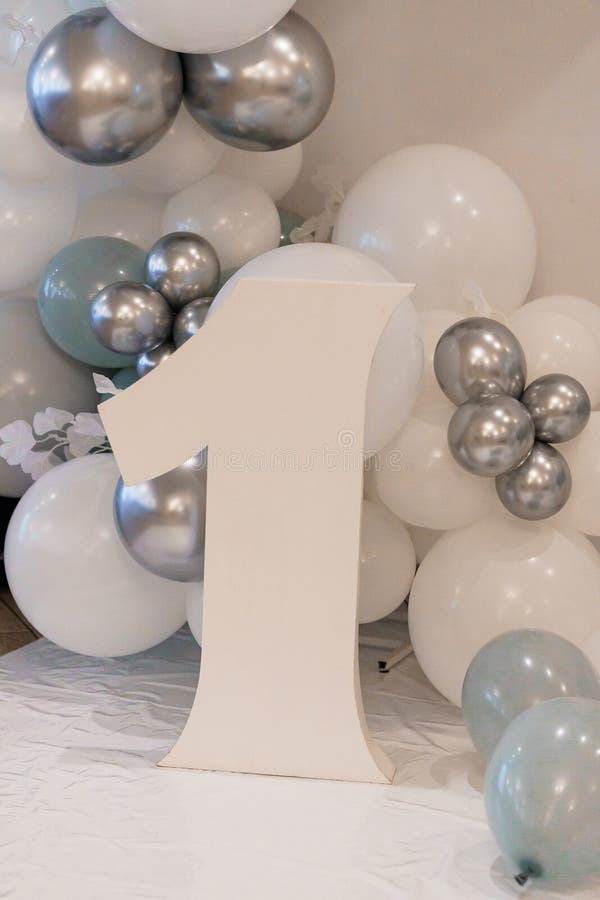 Celebration Backdrop with a Large Number One Surrounded by Balloons ...