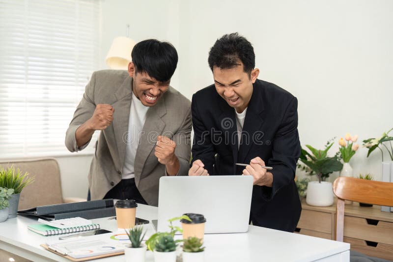 Celebration and Teamwork. Two Men Expressing Joy and Excitement in a ...