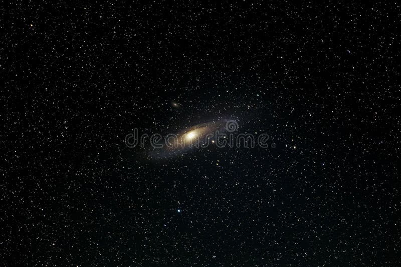 Celestial Body Featuring a Spiral Galaxy with a Distinct Center and ...