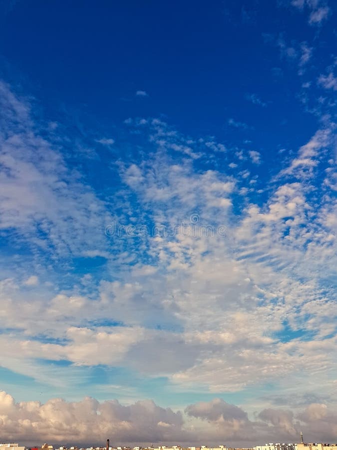 Celestial Canvas: a Blue Sky Dotted with Fluffy White Clouds, Where ...