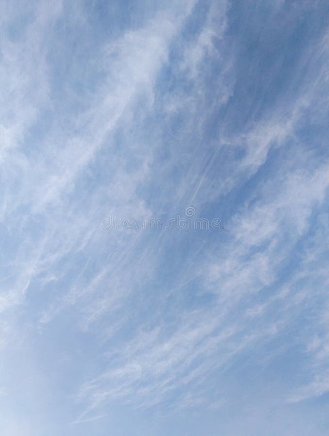 Celestial Canvas: a Serene Blue Sky Adorned with Wispy Clouds Stock Image - Image of bright ...
