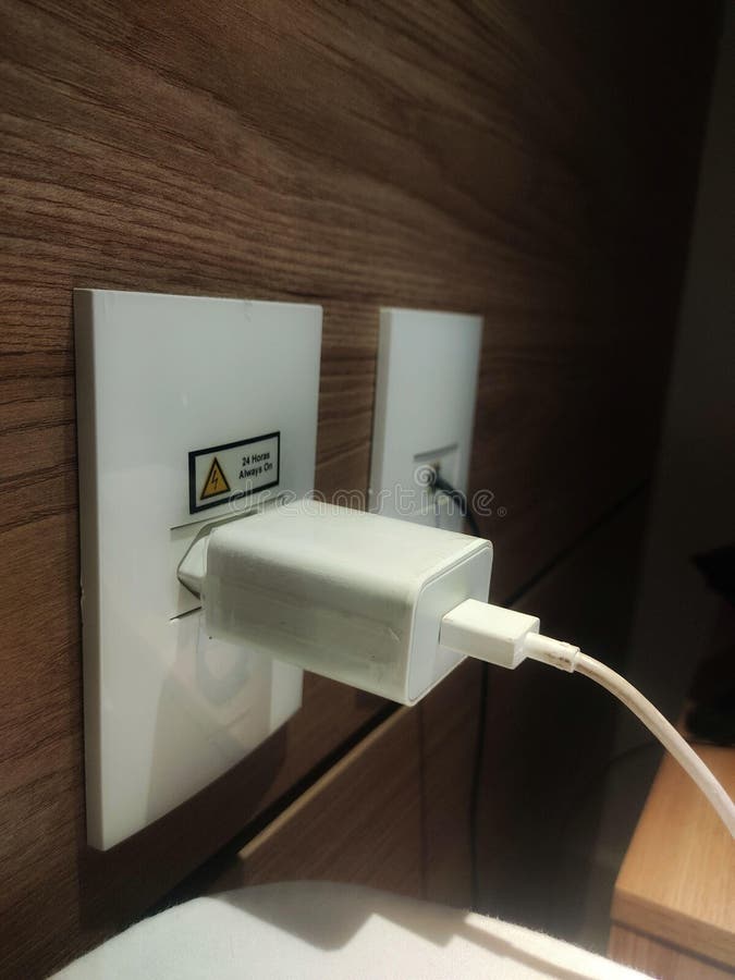 Cell Phone Charger in the Socket Stock Image - Image of gadget, cable ...