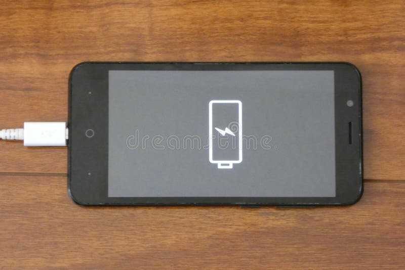 Cell Phone Charging stock image. Image of smartphone - 140810749