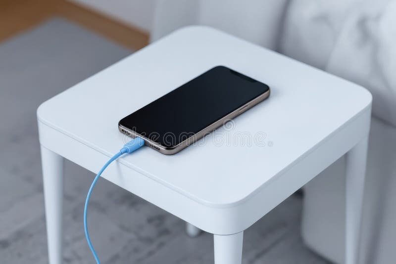 Cell Phone is Charging on a White Table Stock Image - Image of ...