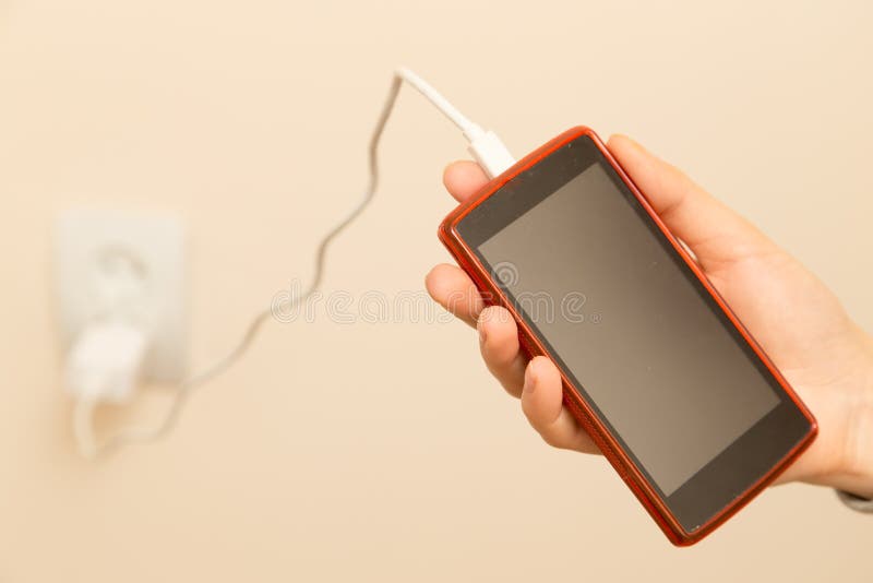 Cell Phone Charging in Your Hand Stock Photo - Image of hand ...