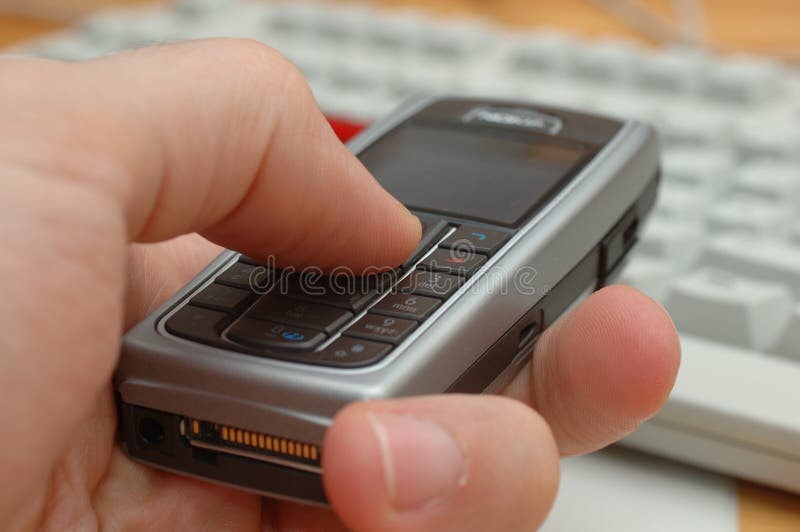 Hand holding mobile phone stock image. Image of finger - 165159