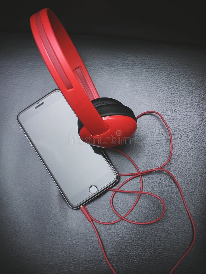 Cell phone with headphones stock image. Image of grey - 90215527