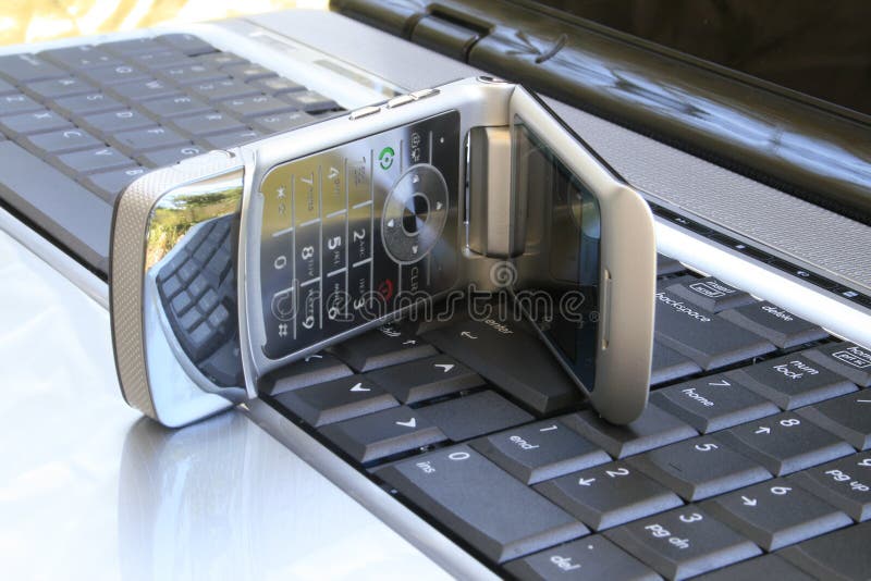 Cell phone on the keyboard stock photo. Image of grid - 2715190
