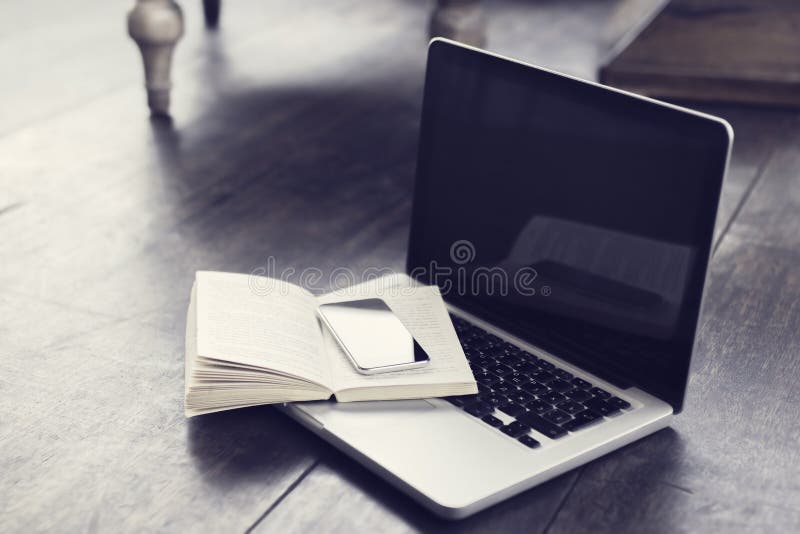 Cell Phone with Open Book and Laptop on the Floor Stock Image - Image ...