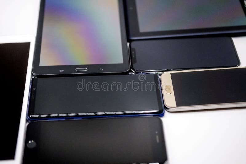 Cell Phones and Digital Pads Spread on Studio Setup Stock Photo - Image ...