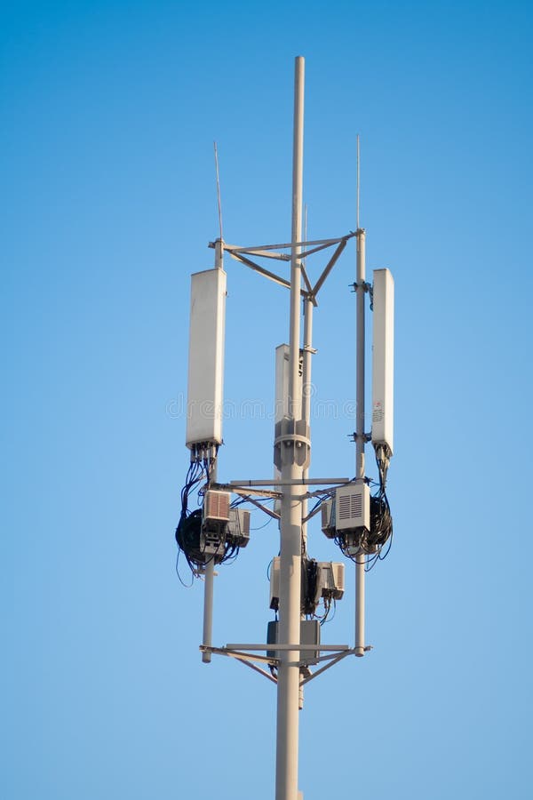 A Cell Tower Against a Blue Sky. Wireless Communication, Mobile ...