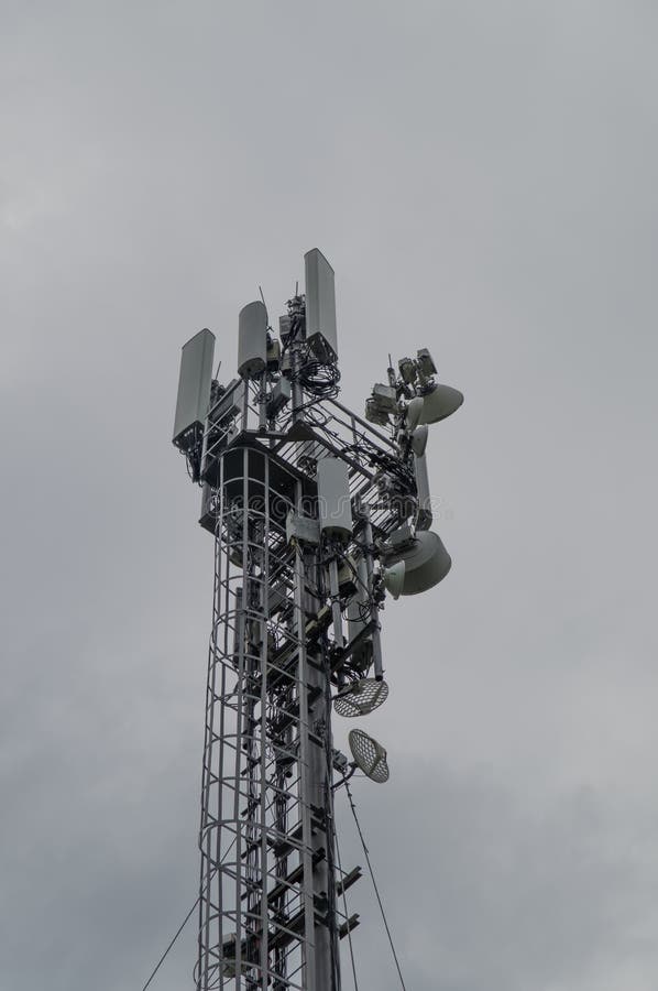 Cell Tower in Cloudy Weather Stock Photo - Image of equipment ...