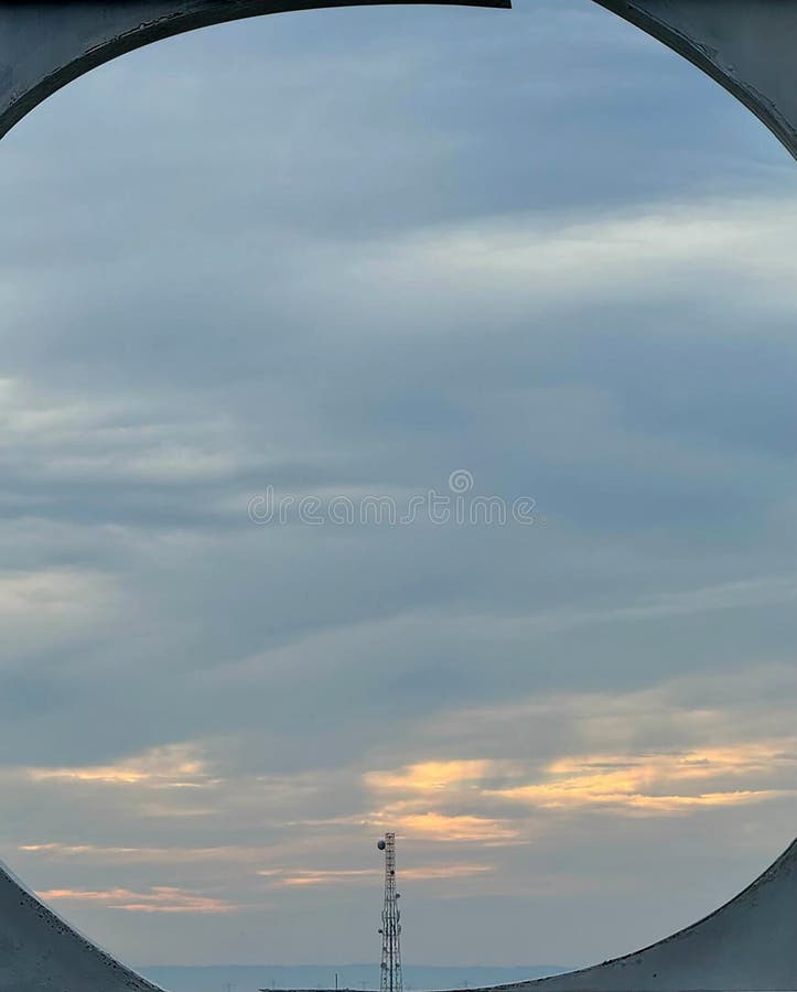 Cell Tower Framed by Evening Sky Viewed through Circular Opening Stock ...
