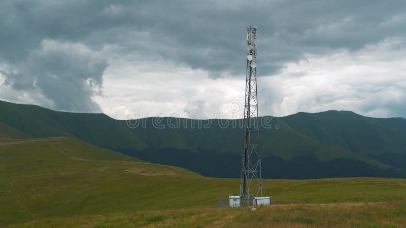 Cell Tower in the Mountains with Storm Clouds Stock Footage - Video of ...