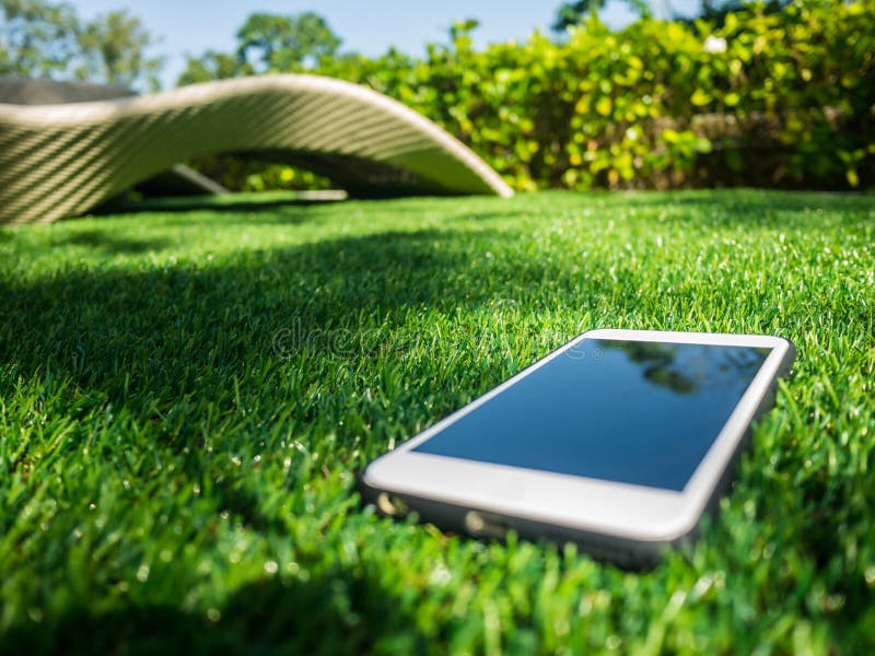 Cellphone on a Artificial Grass Field Stock Image - Image of green ...