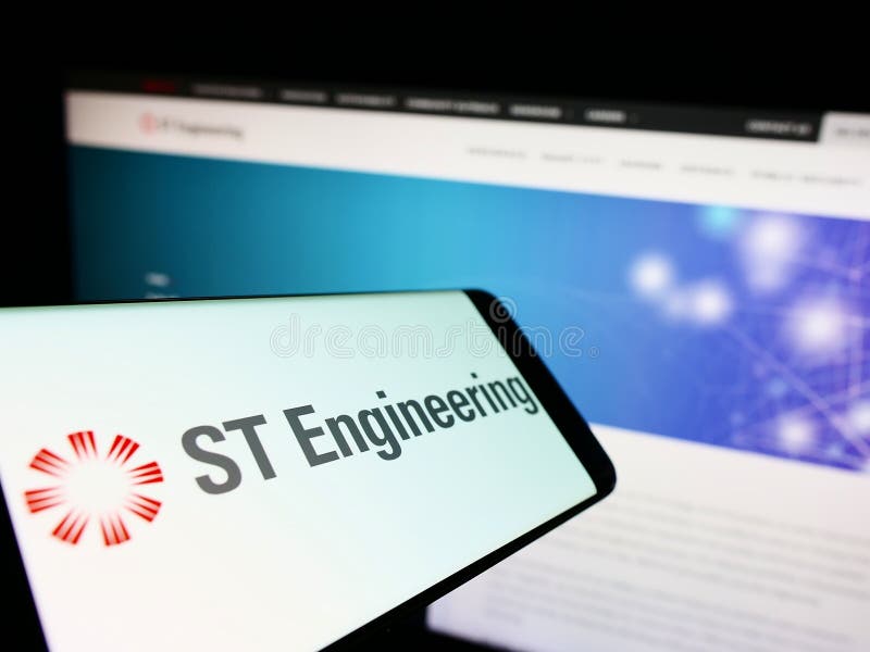 Cellphone with Logo of Singapore Technologies Engineering Ltd. (ST) on Screen in Front of ...