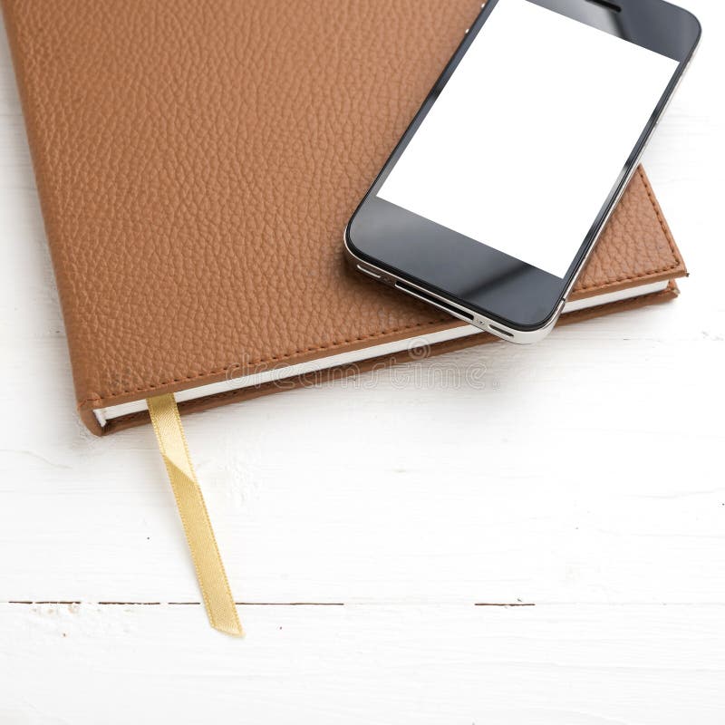 Cellphone on notebook stock image. Image of touch, smartphone - 60464579