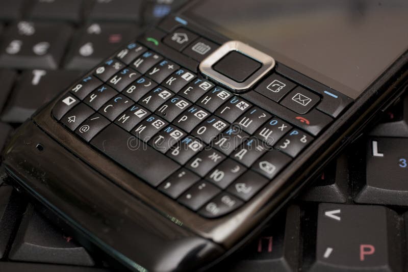 Cellphone over keyboard stock image. Image of browser - 12851083