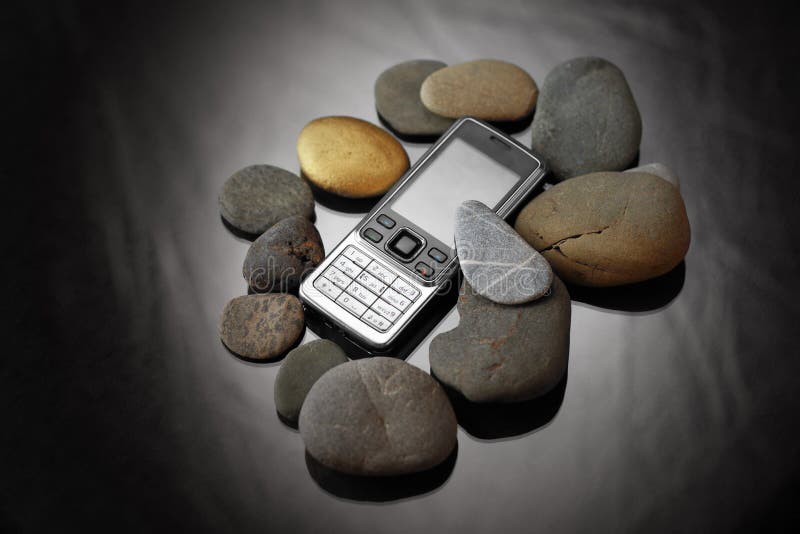 Cellphone and stones stock photo. Image of indoors, color - 10894002