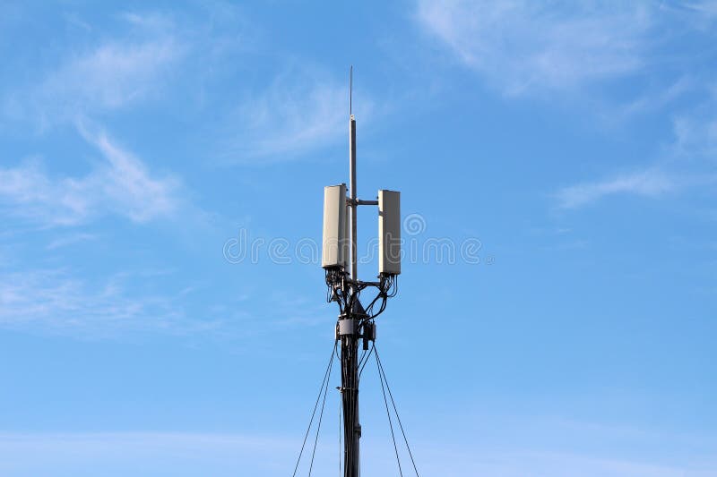 Cellular Antenna Tower with Cables Against Blue Sky Stock Image - Image ...