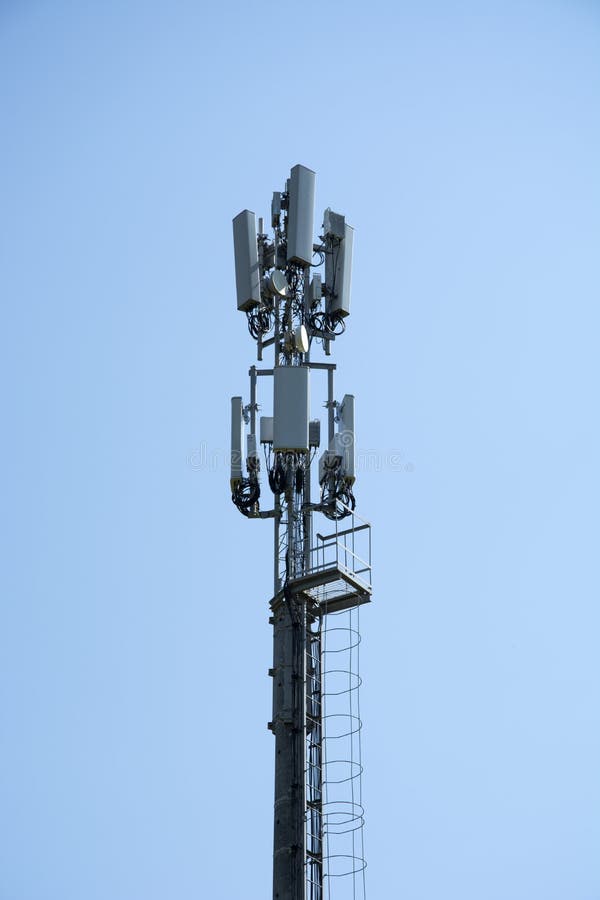 Cellular Communication on the Pole. High-rise Telephone Pole in a Field ...