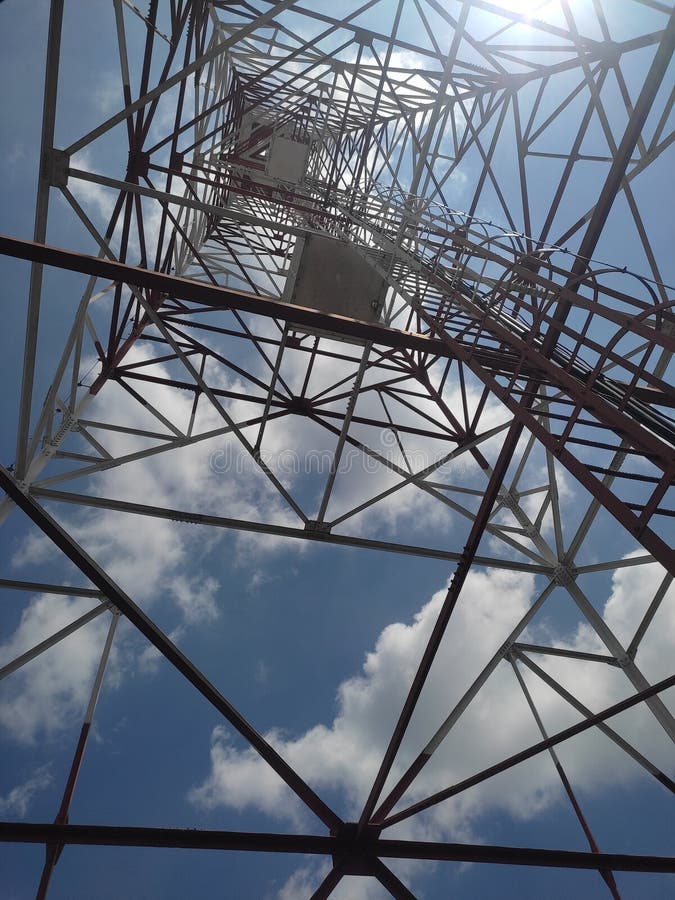 A Cellular Network Tower Viewed from Below, Silhouetted Against a ...