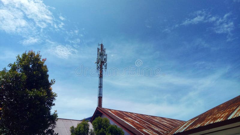 A Cellular Tower Behind the School Buildings Stock Image - Image of ...