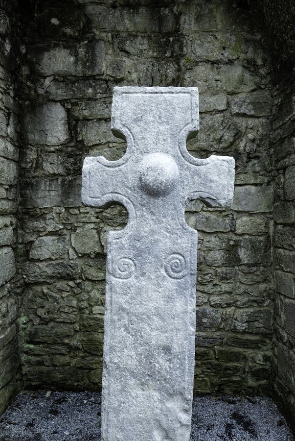 Celtic Cross Made of Stone in a Stone Wall Enclosure Stock Photo ...