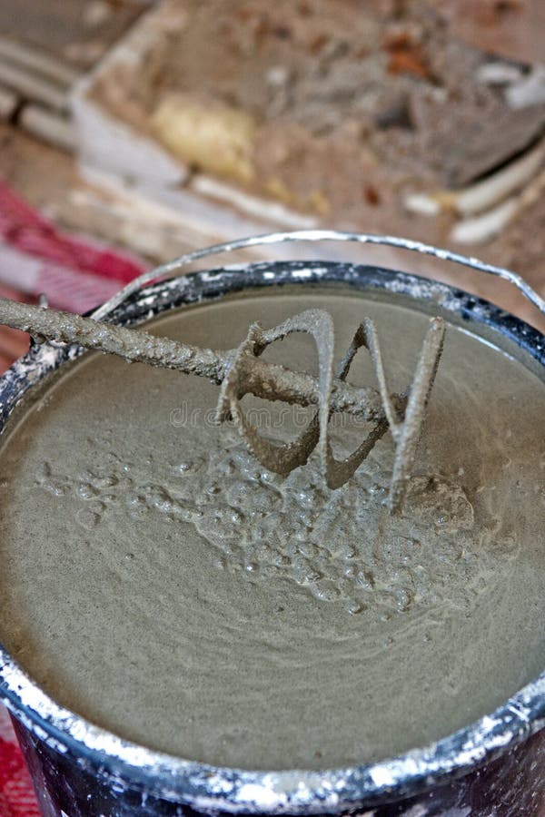 Making cement in a bucket stock photo. Image of building - 27514104