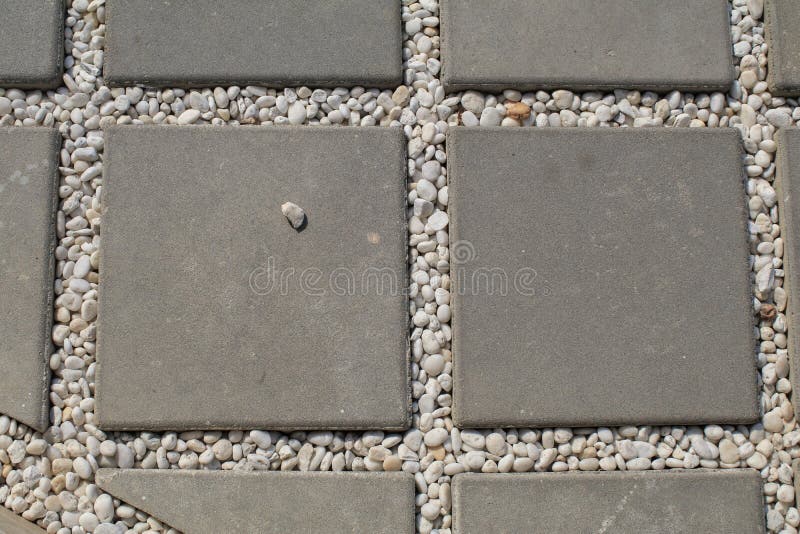 Cement Brick Squared Stone Floor and Whit Rock Background. Stock Photo ...