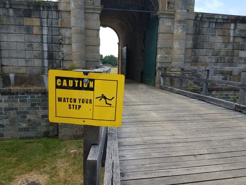 Cement Building with Yellow Caution Sign Stock Image - Image of warning ...