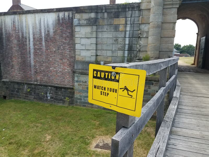 Cement Building with Yellow Caution Sign Stock Image - Image of warning ...