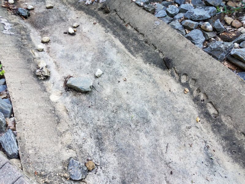 Cement or Concrete Gutter with Rocks or Stones Stock Image - Image of ...