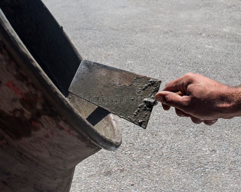 Cement Mixer and a Hand Holding a Trowel. Stock Image - Image of build ...
