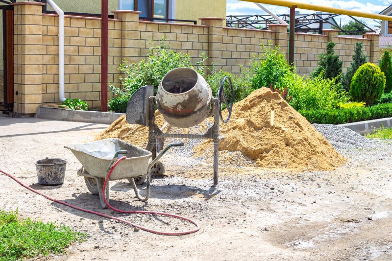 Cement Mixer Machine at Construction Site, Tools and Sand Stock Image ...