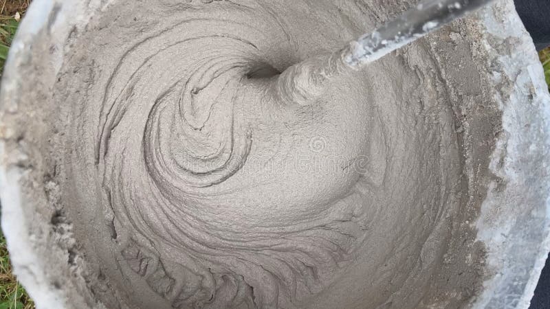 Construction Worker Mixing Cement in Bucket Using Mixing Drill Stock ...
