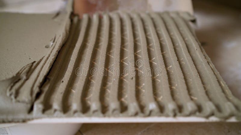 Cement Mixture on Ceramic Tiles, Close-up. Close-up of a Layer of ...