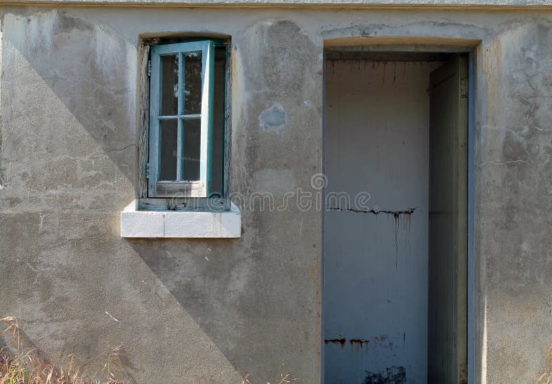 Cement Outbuilding with Open Window and Missing Door Stock Photo ...