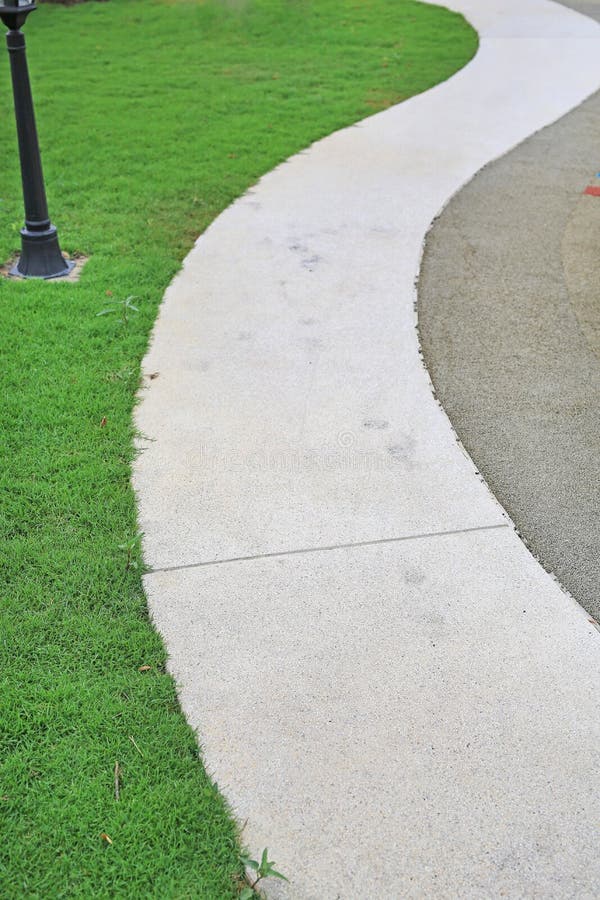 Cement Path Walkway with Green Grass beside in the Garden Stock Photo ...