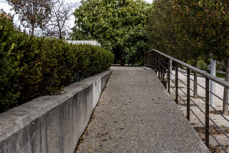 Cement Ramp with Metal Bar Inside an Urban Park Stock Photo - Image of ...