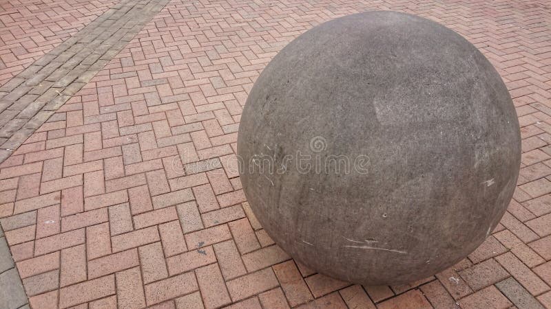 Cement sphere on tiles stock image. Image of modern - 121787503