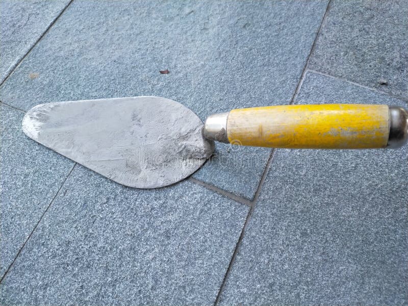 A Cement Spoon on the Stone Floor Stock Photo - Image of wing, flooring ...
