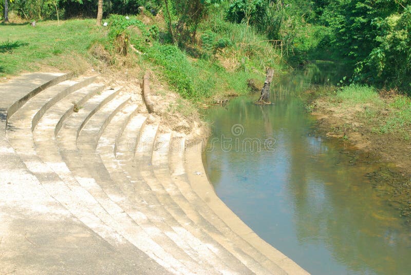 Stairs down the stream. stock photo. Image of pervious - 165424310
